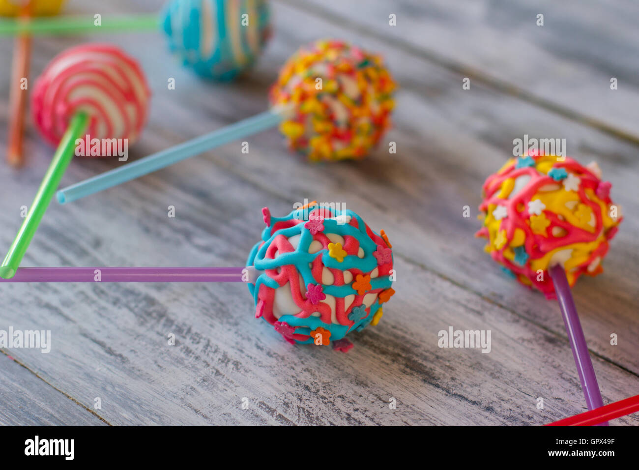 Round candies on sticks Stock Photo - Alamy