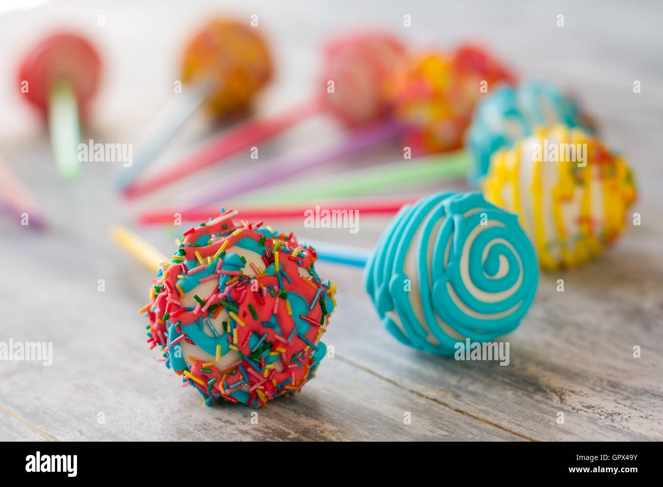 Ball-shaped sweets on sticks Stock Photo - Alamy