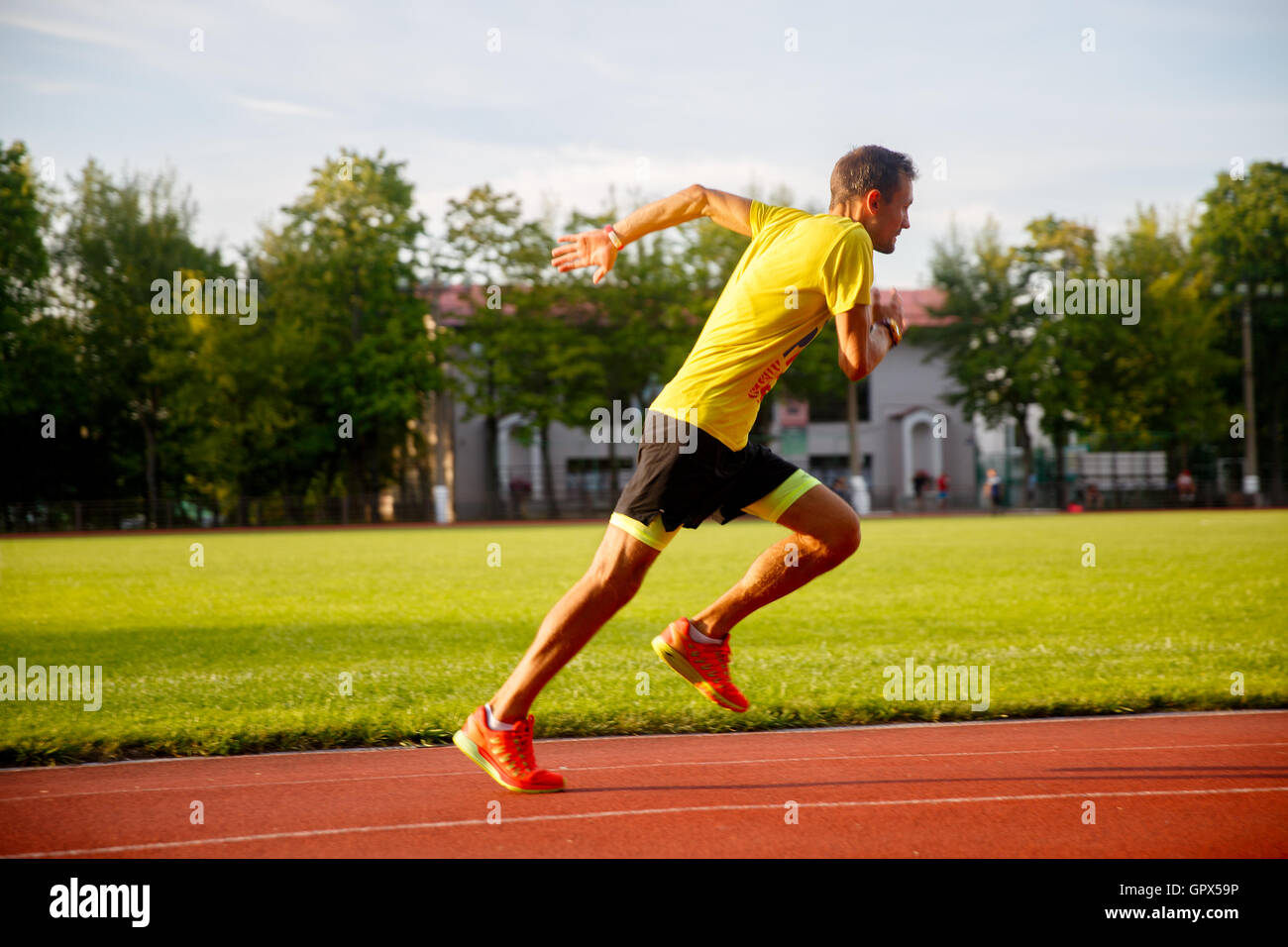 young runner runs stadium summer Stock Photo - Alamy