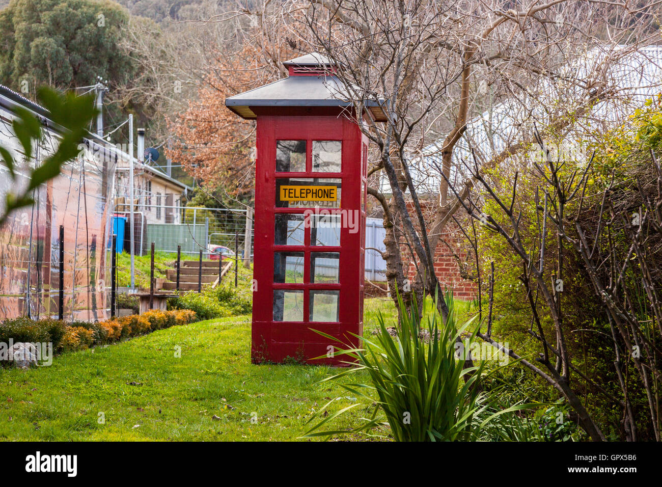 An old style red telephone booth in a grassy country lane Stock Photo ...