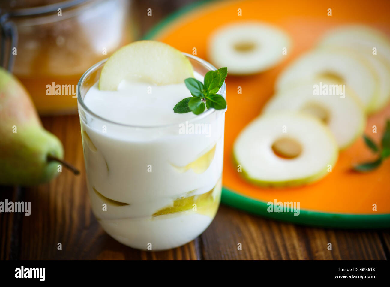 sweet pears with yogurt and honey Stock Photo - Alamy