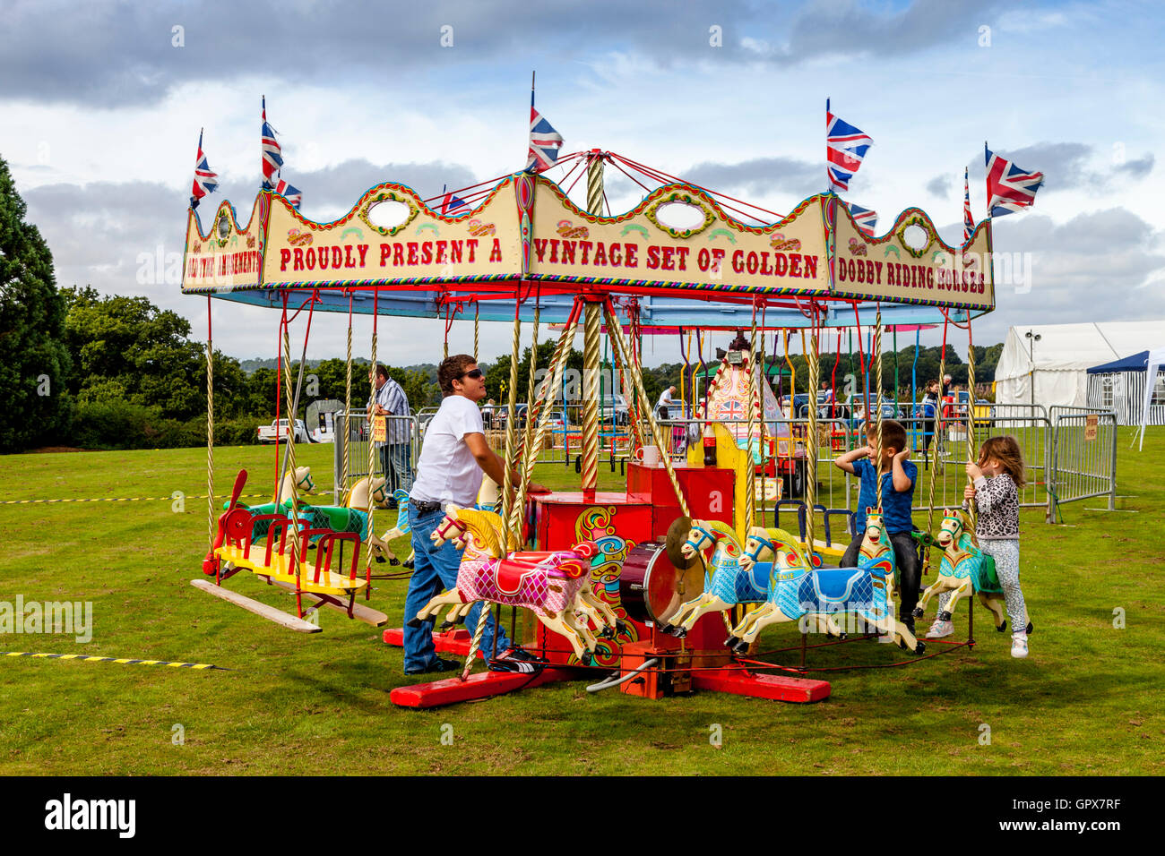 Girl riding on merry go round hi-res stock photography and images - Alamy