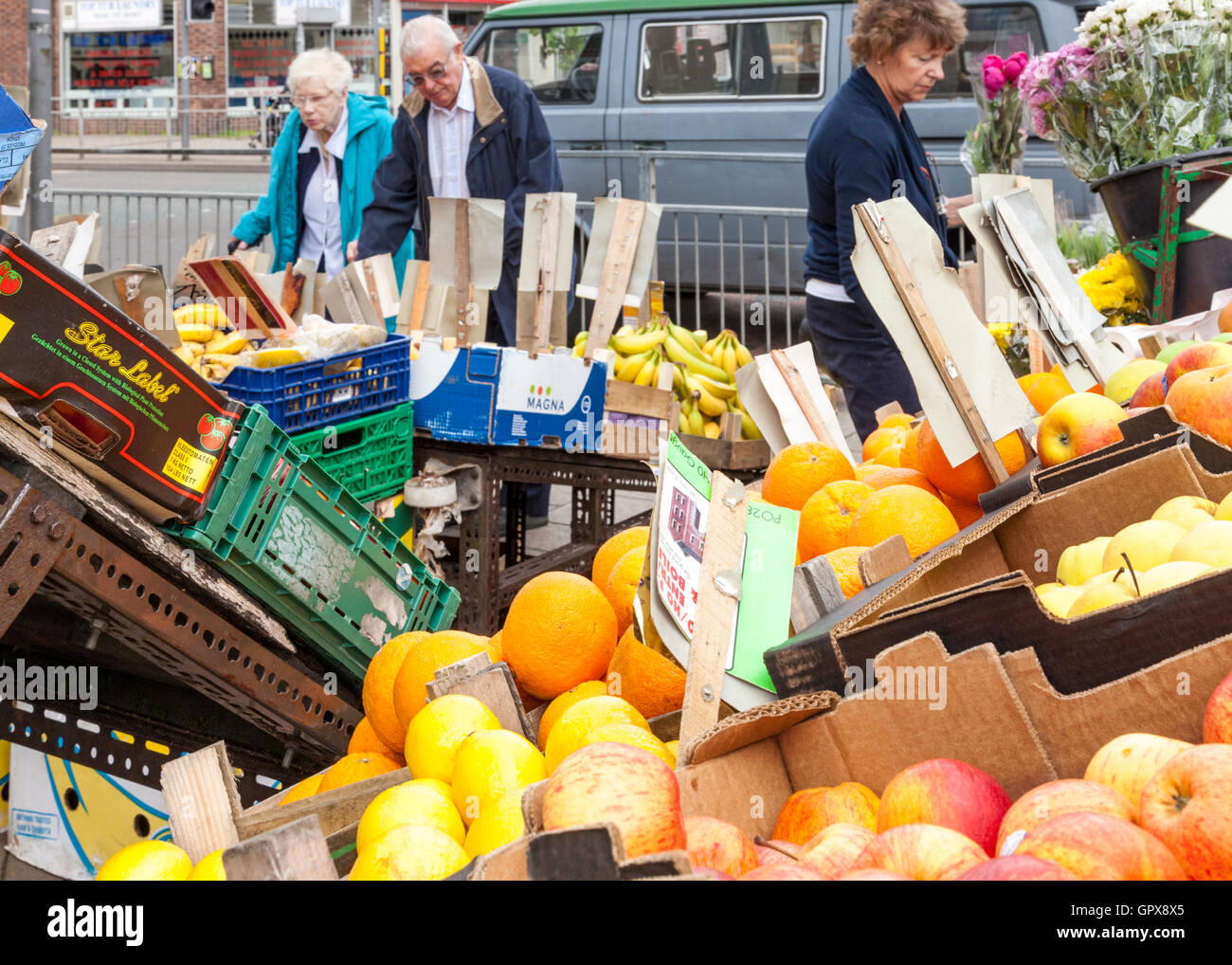 Shopping for fruit and veg at a local shop on the high street ...