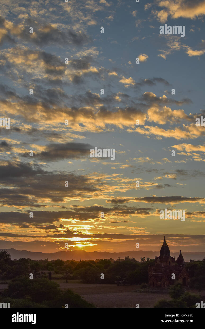 A beautiful sunset with a pagoda, temples in Bagan, Myanmar Stock Photo ...