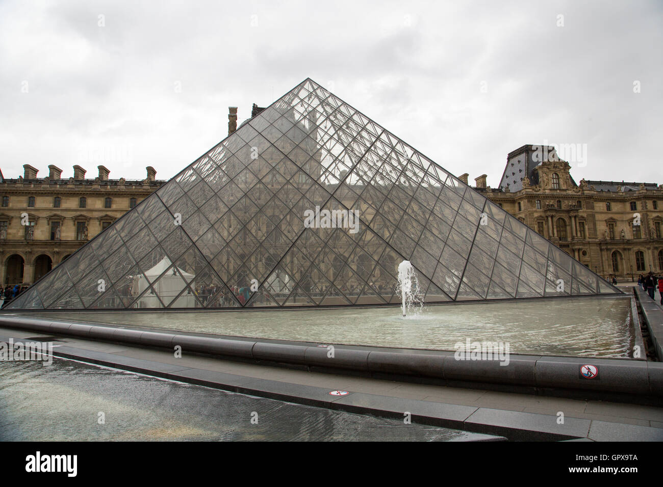 Famous Louvre Museum Pyramid made of glass in Paris, France Stock Photo ...