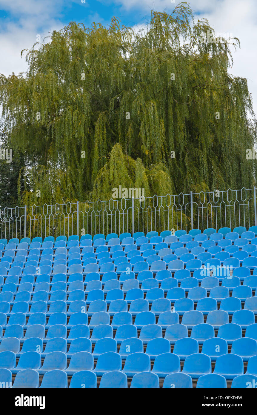 The photographic image of plastic folding chairs on sports arena Stock ...