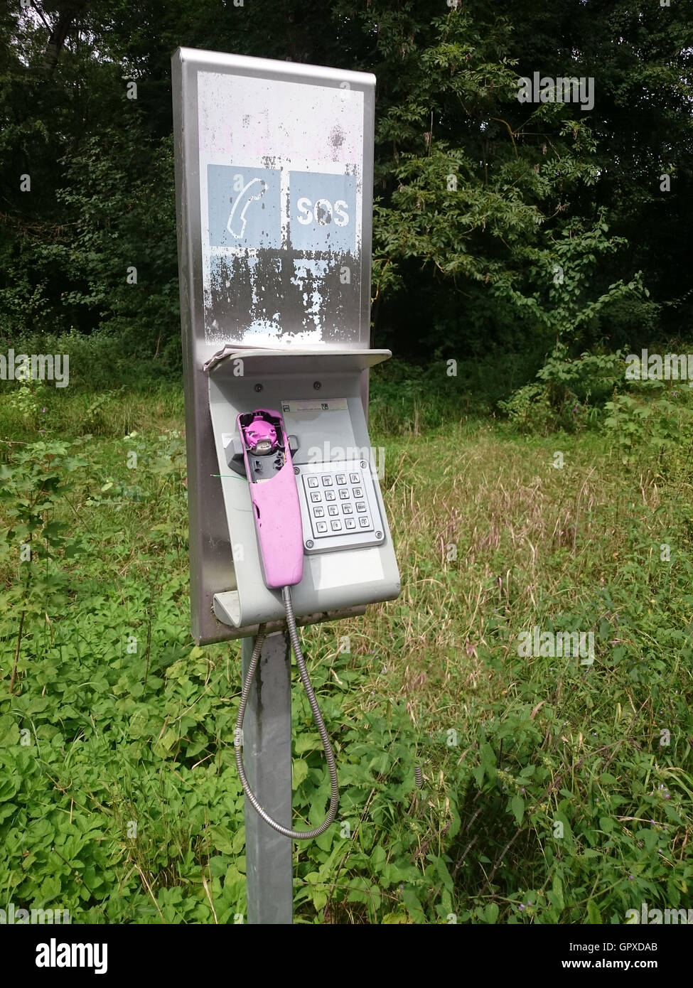 SOS damaged phone box Stock Photo - Alamy