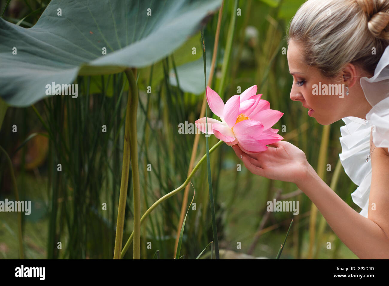 happy bride smelling a lotus Stock Photo - Alamy