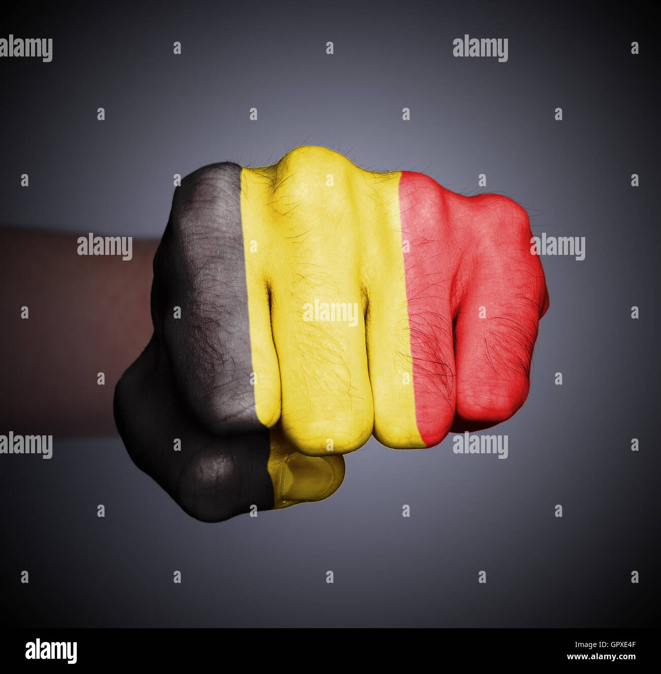 Front view of punching fist on gray background Stock Photo - Alamy