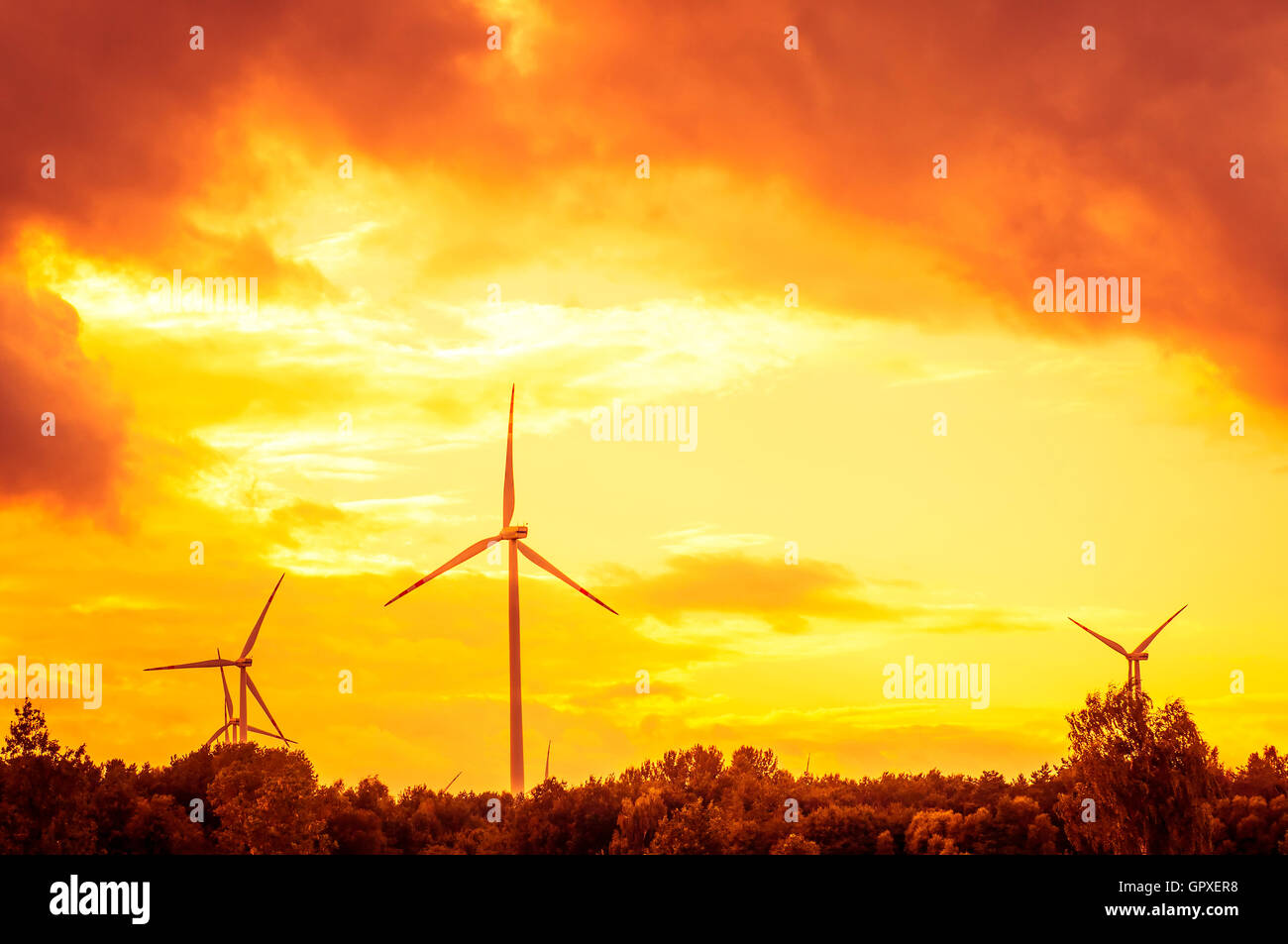 Windturbine during beautiful sunset Stock Photo - Alamy