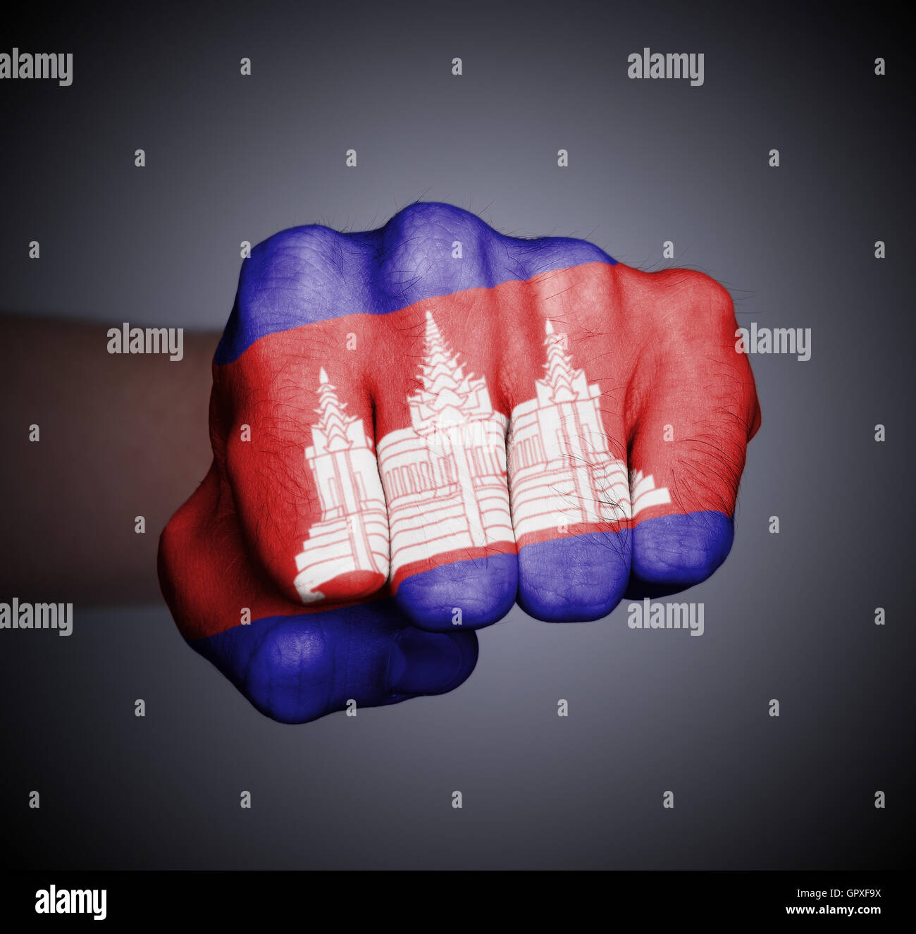 Front view of punching fist on gray background Stock Photo - Alamy