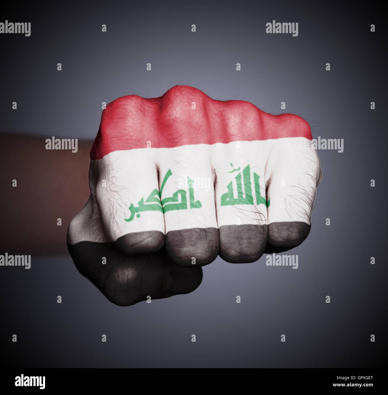 Front view of punching fist on gray background Stock Photo - Alamy