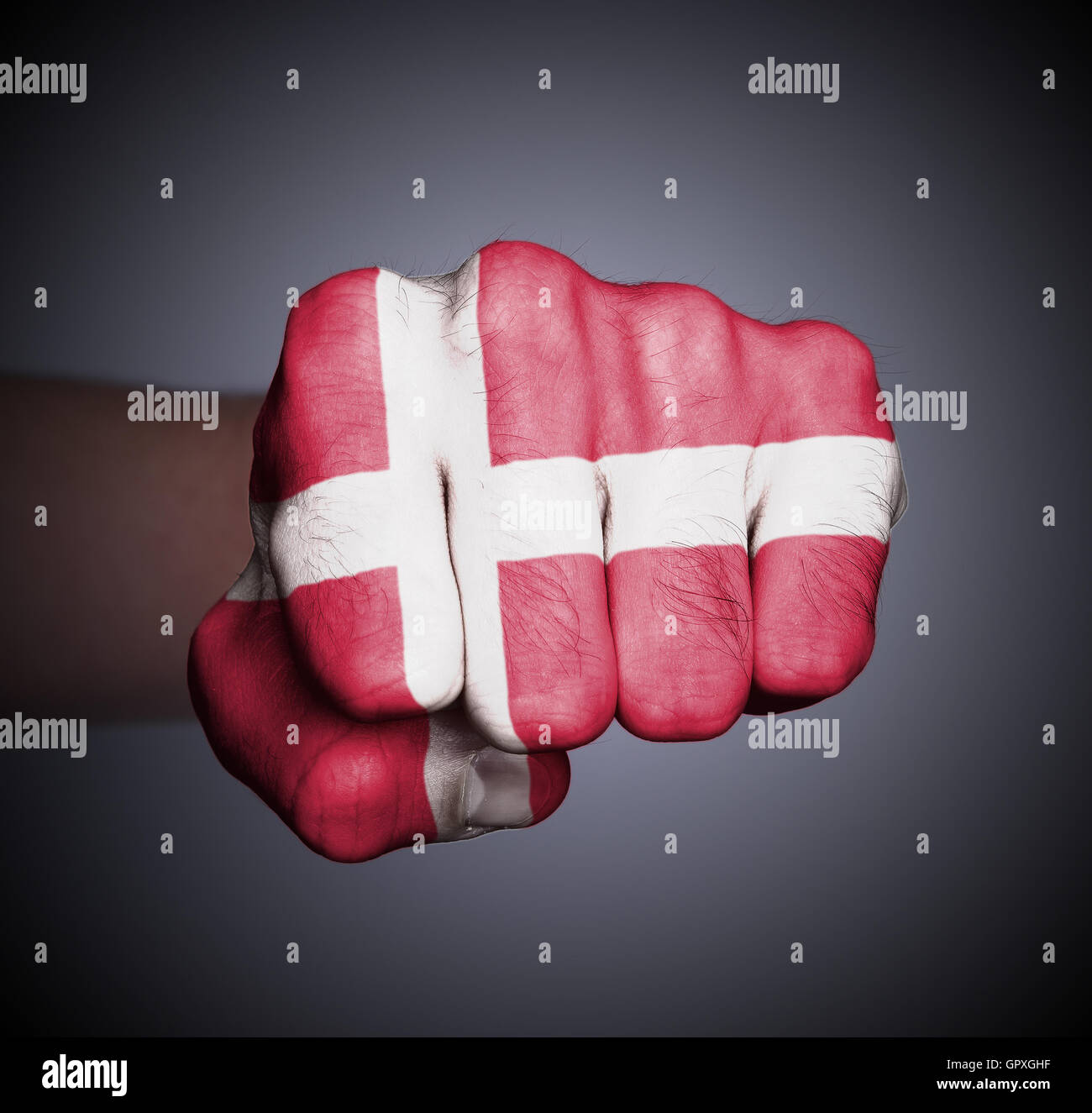 Front view of punching fist on gray background Stock Photo - Alamy