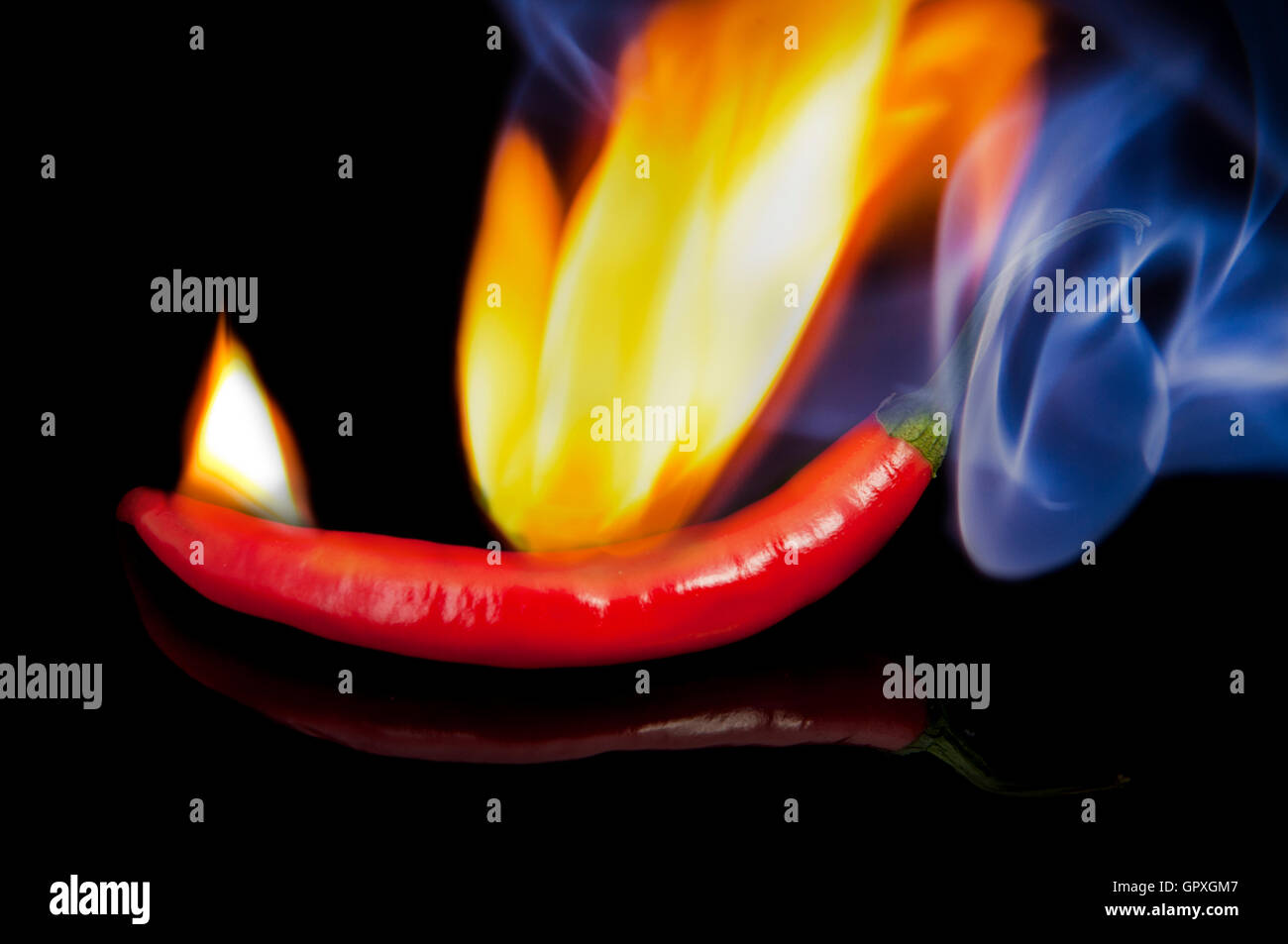 Red hot chilli pepper with flame Stock Photo - Alamy