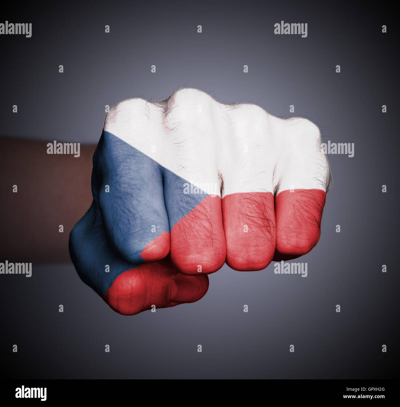 Front view of punching fist on gray background Stock Photo - Alamy