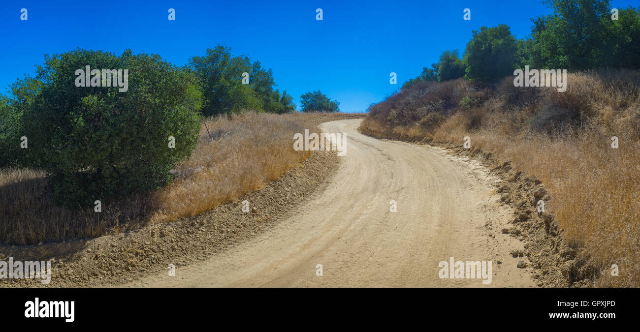Winding dirt road through the southern California hills near Los ...