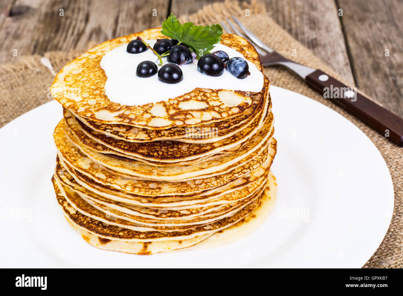 Tasty Pancakes with Black Currant Stack Stock Photo - Alamy