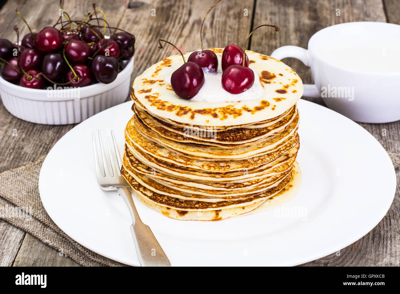 Tasty Pancakes with Cherry Stack Stock Photo - Alamy