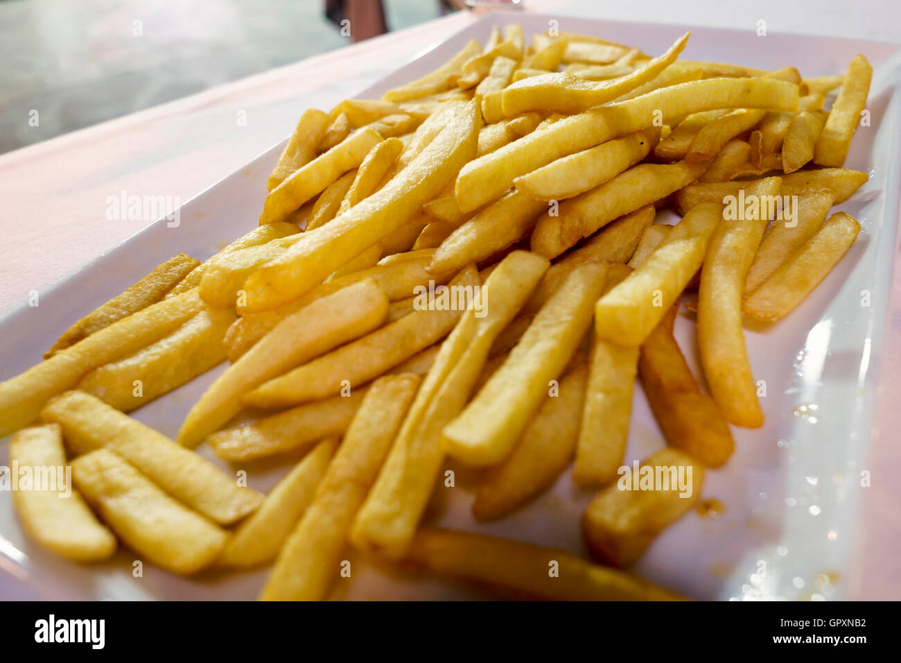 many french fries in dish at restaurant Stock Photo - Alamy
