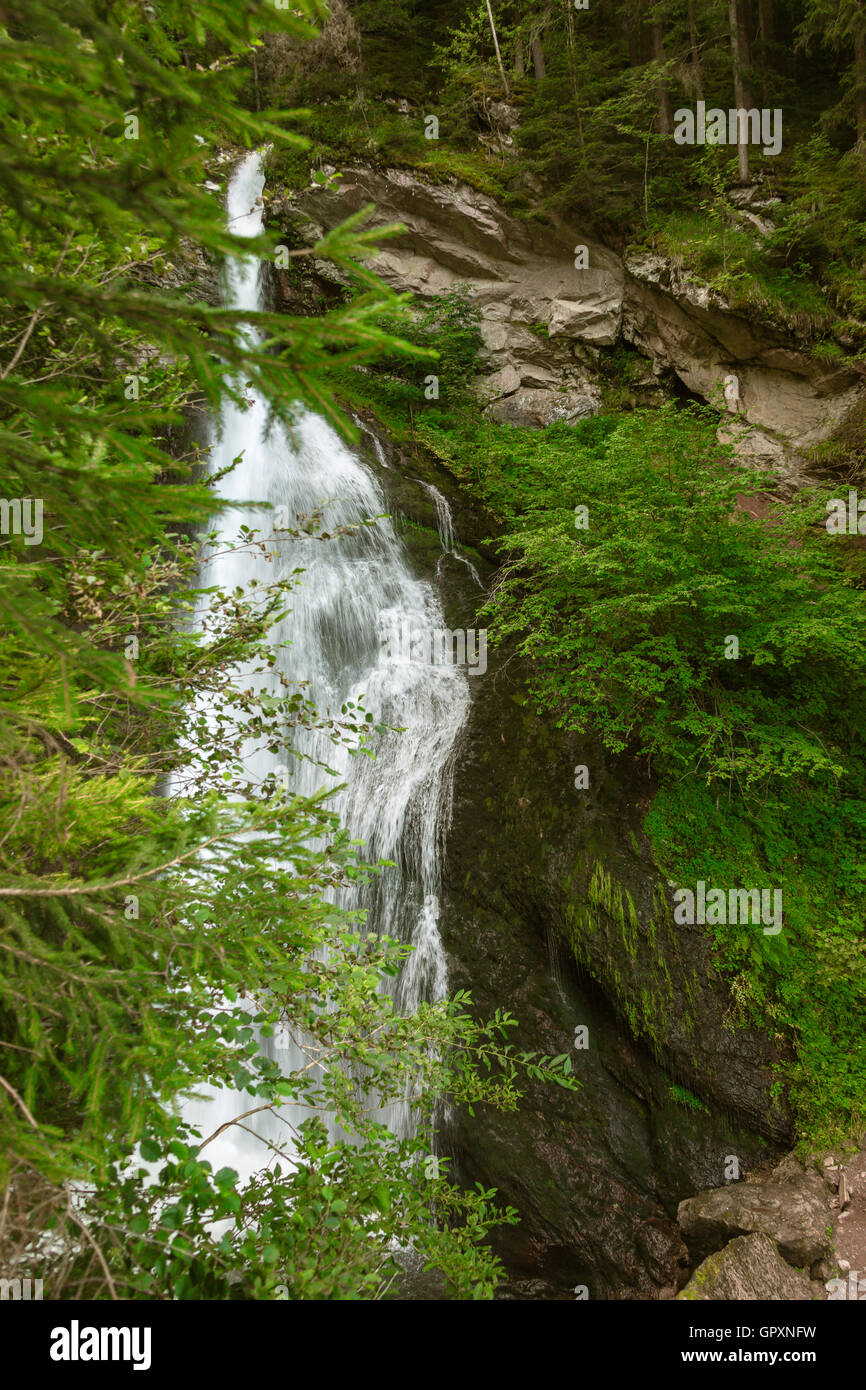 waterfall flowing over rocks in the Alps Stock Photo - Alamy