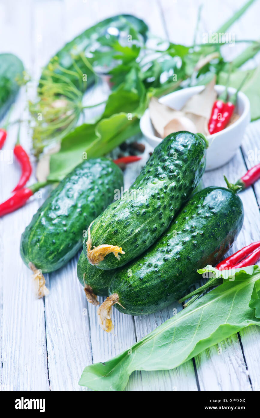 fresh cucumbers with salt and spice on the wooden table Stock Photo - Alamy