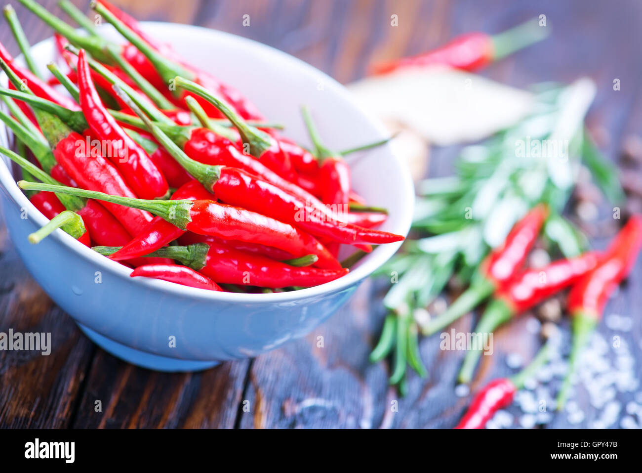 red hot chilli with salt and aroma spice on a table Stock Photo - Alamy