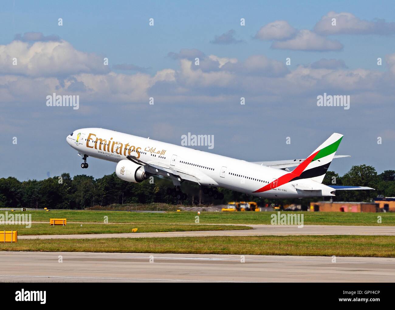 Emirates Boeing 777-300 taking off from Manchester Airport, Manchester ...