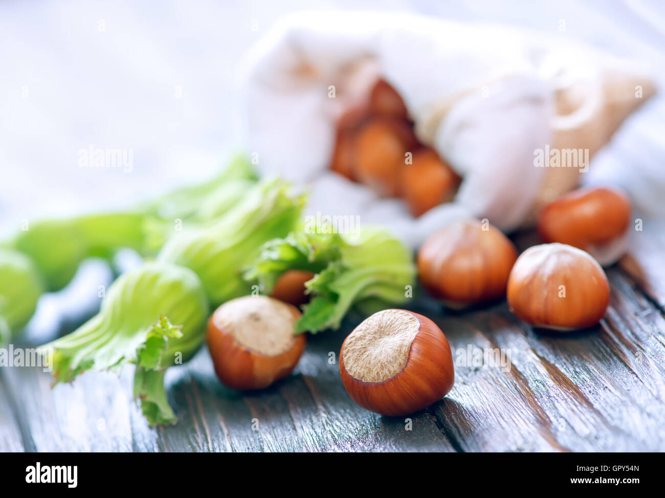 hazelnuts on the wooden table, autumn harvest of nuts Stock Photo - Alamy