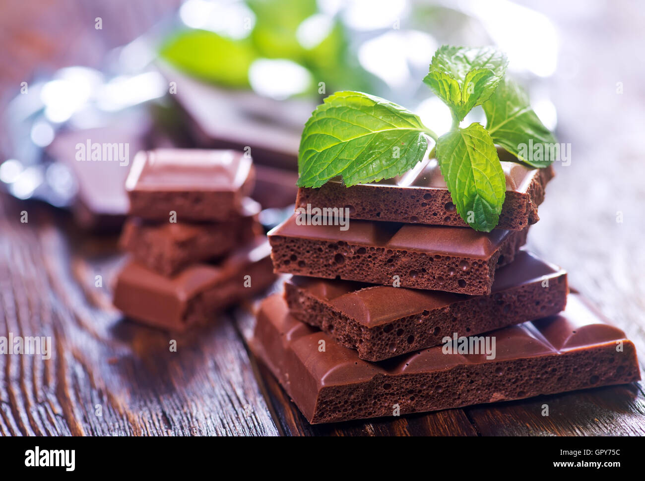 chocolate on a table, sweet chocolate on the wooden table Stock Photo ...