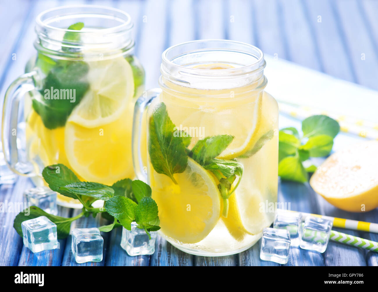 lemonate in glass and on a table Stock Photo - Alamy