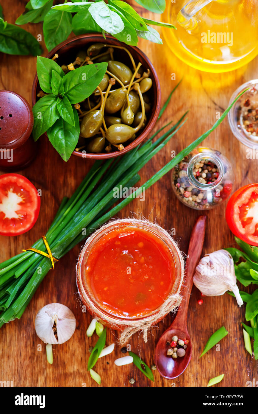 salsa in glass bank and on a table Stock Photo - Alamy