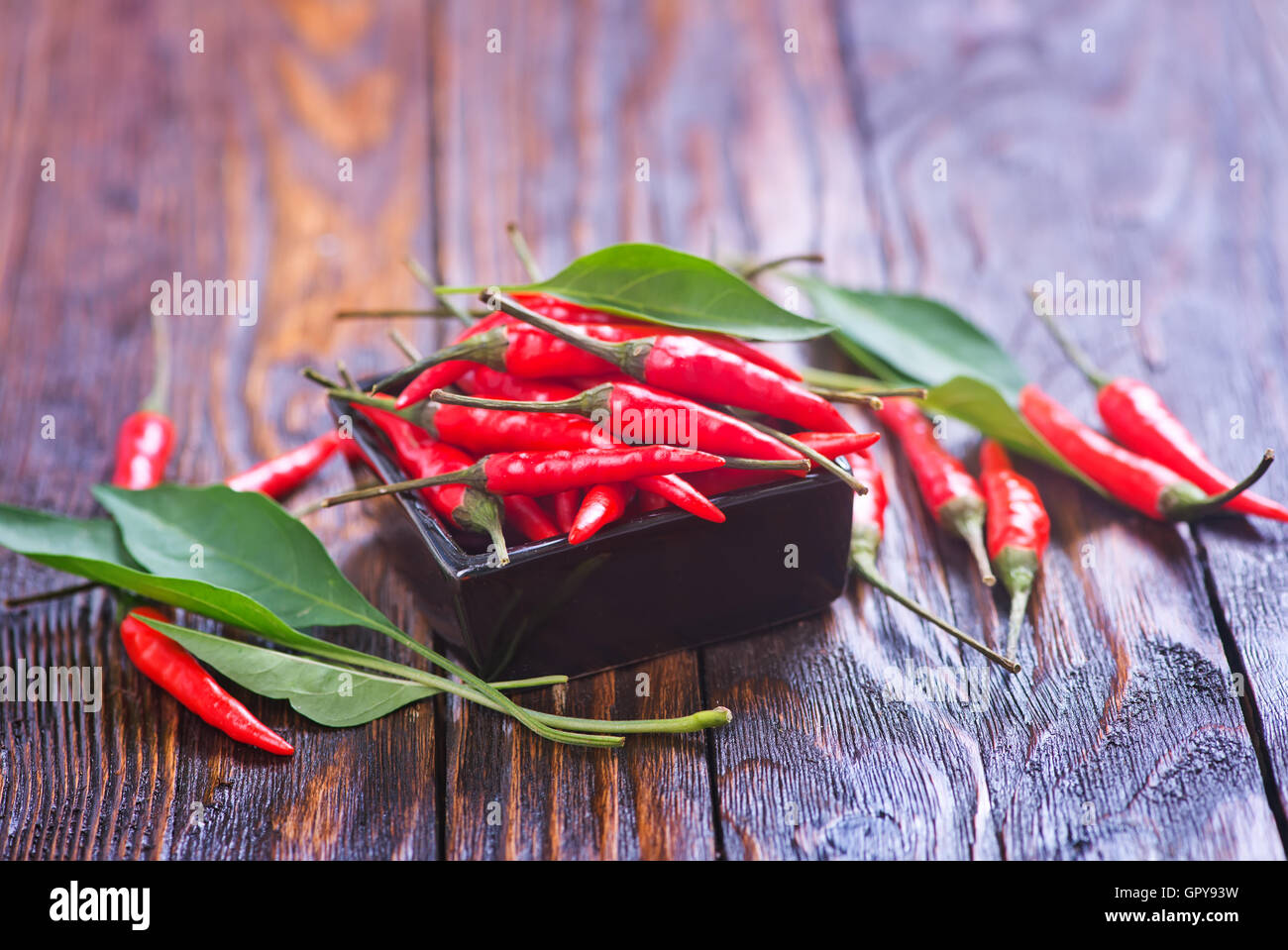 red hot chilli peppers on a table Stock Photo - Alamy