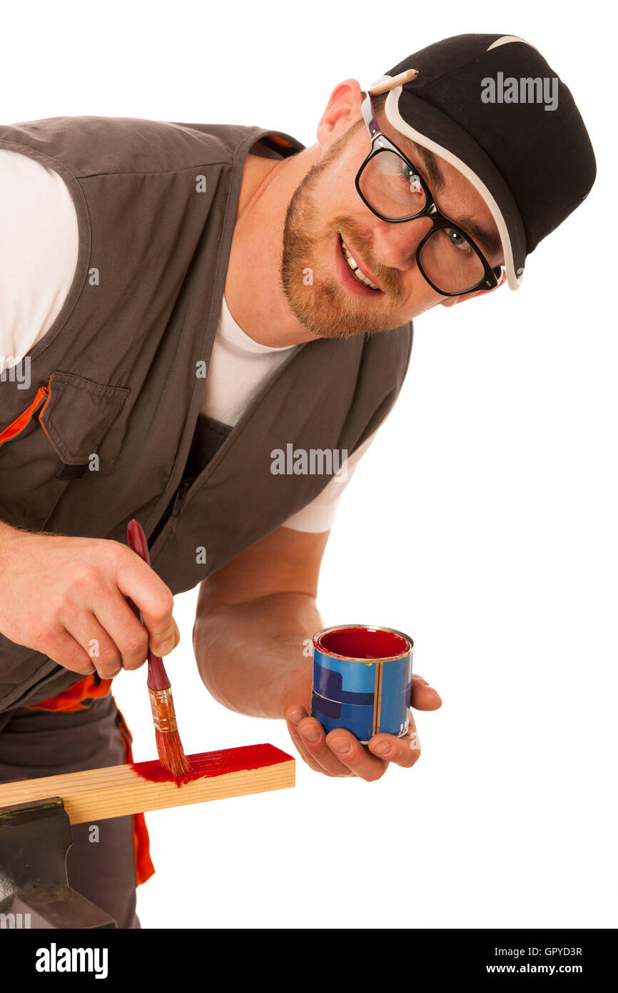 A carpenter painting wood in red color isolated over white diy Stock ...