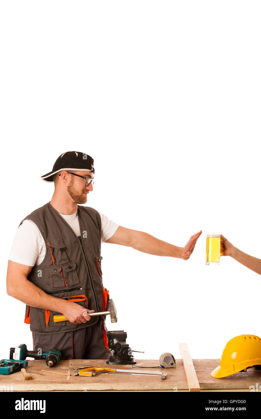 Handyman in work clothing refusing beer, don't drink on workplace ...