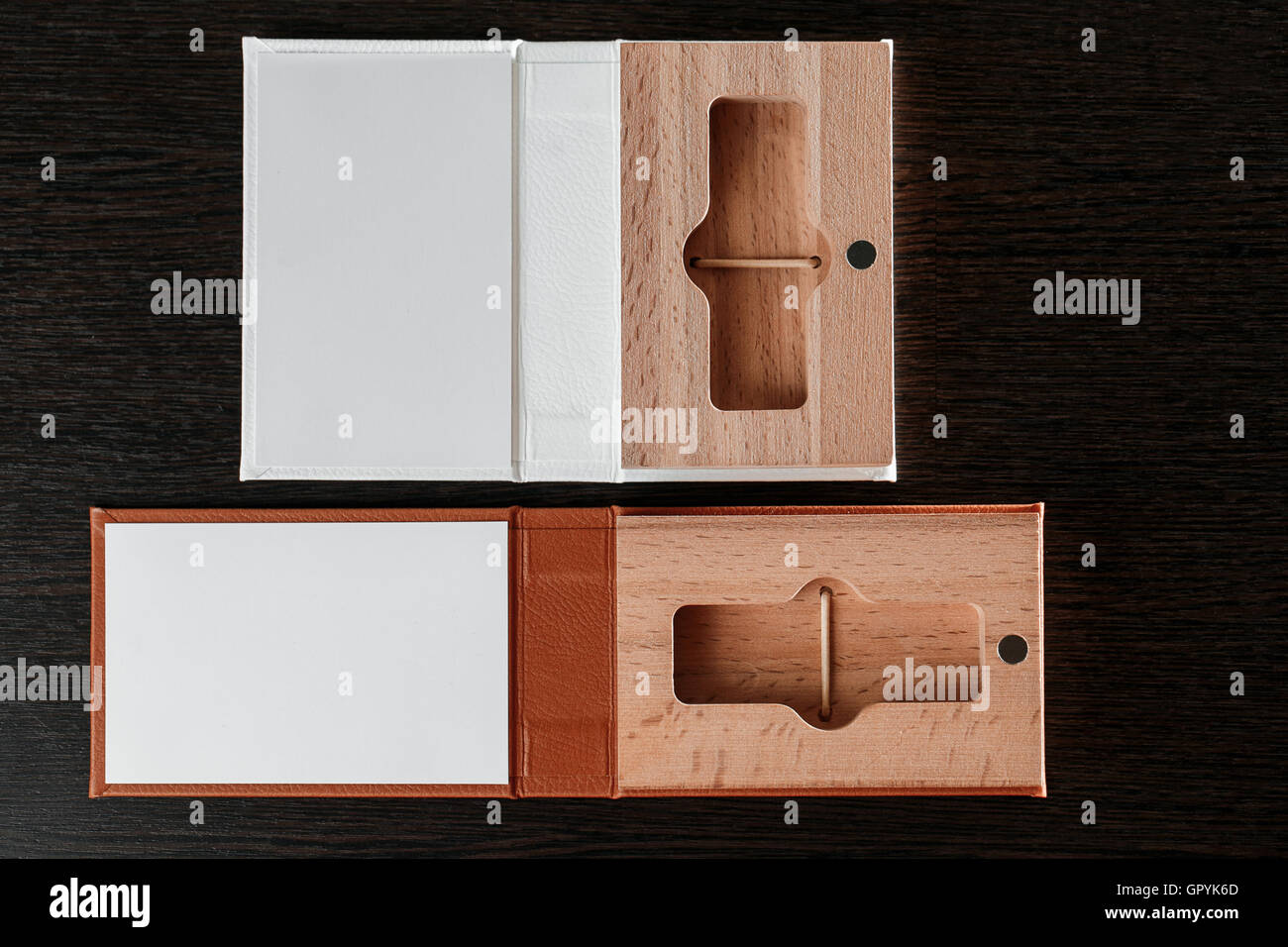 Packaging for USB drives. Handmade box. Wooden boxes on dark background ...
