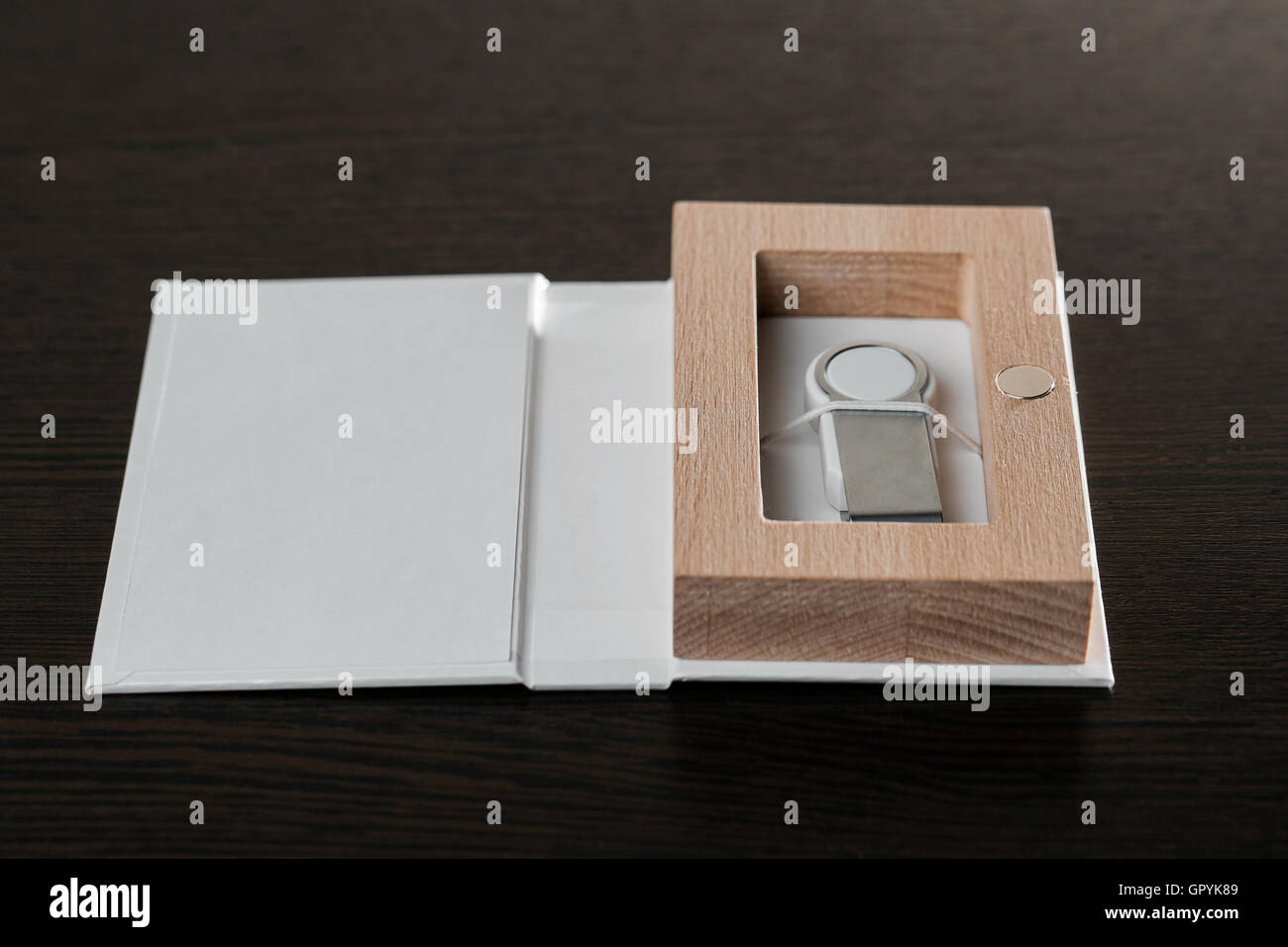 Packaging for USB drives. Handmade box. Wooden boxes on dark background ...