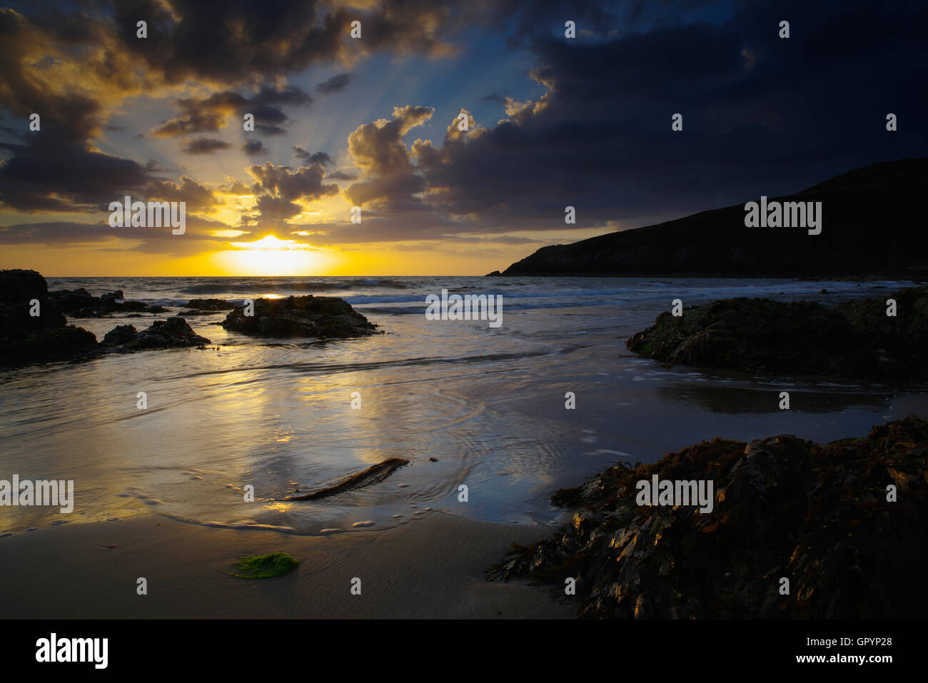 Sunset at Church Bay, Anglesey, Wales Stock Photo - Alamy