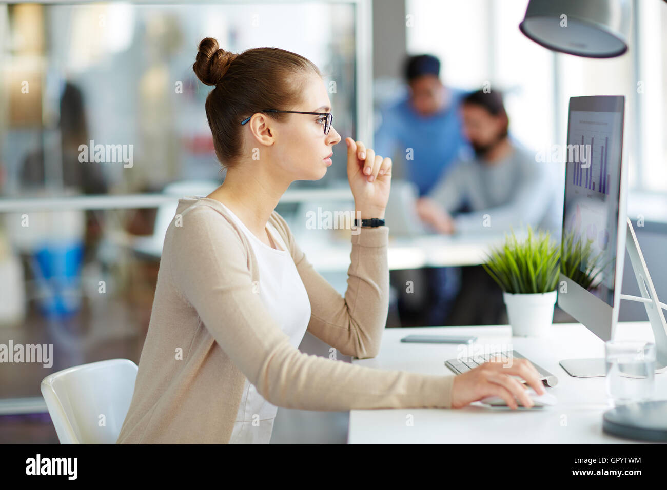 Young Marketing Professional Looking at Data Stock Photo - Alamy