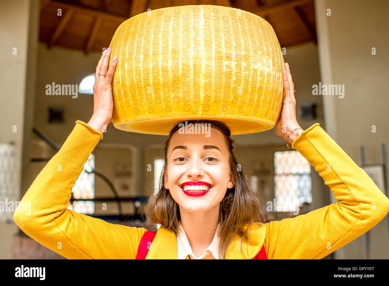 Woman with parmesan cheese Stock Photo - Alamy