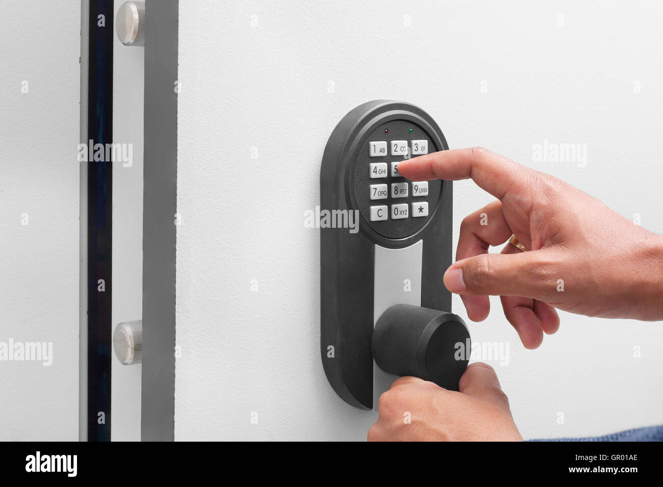 Interracial businessman hand entering security system code Stock Photo ...