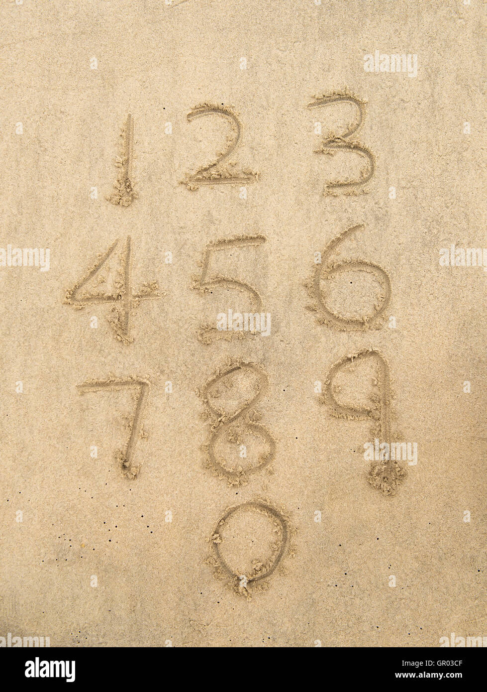 Numbers from one to ten written on a sandy beach Stock Photo - Alamy