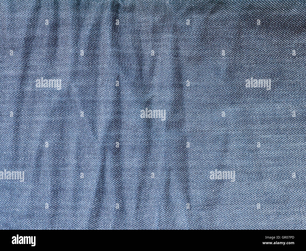 Crumpled dark blue washed denim fabric background Stock Photo - Alamy