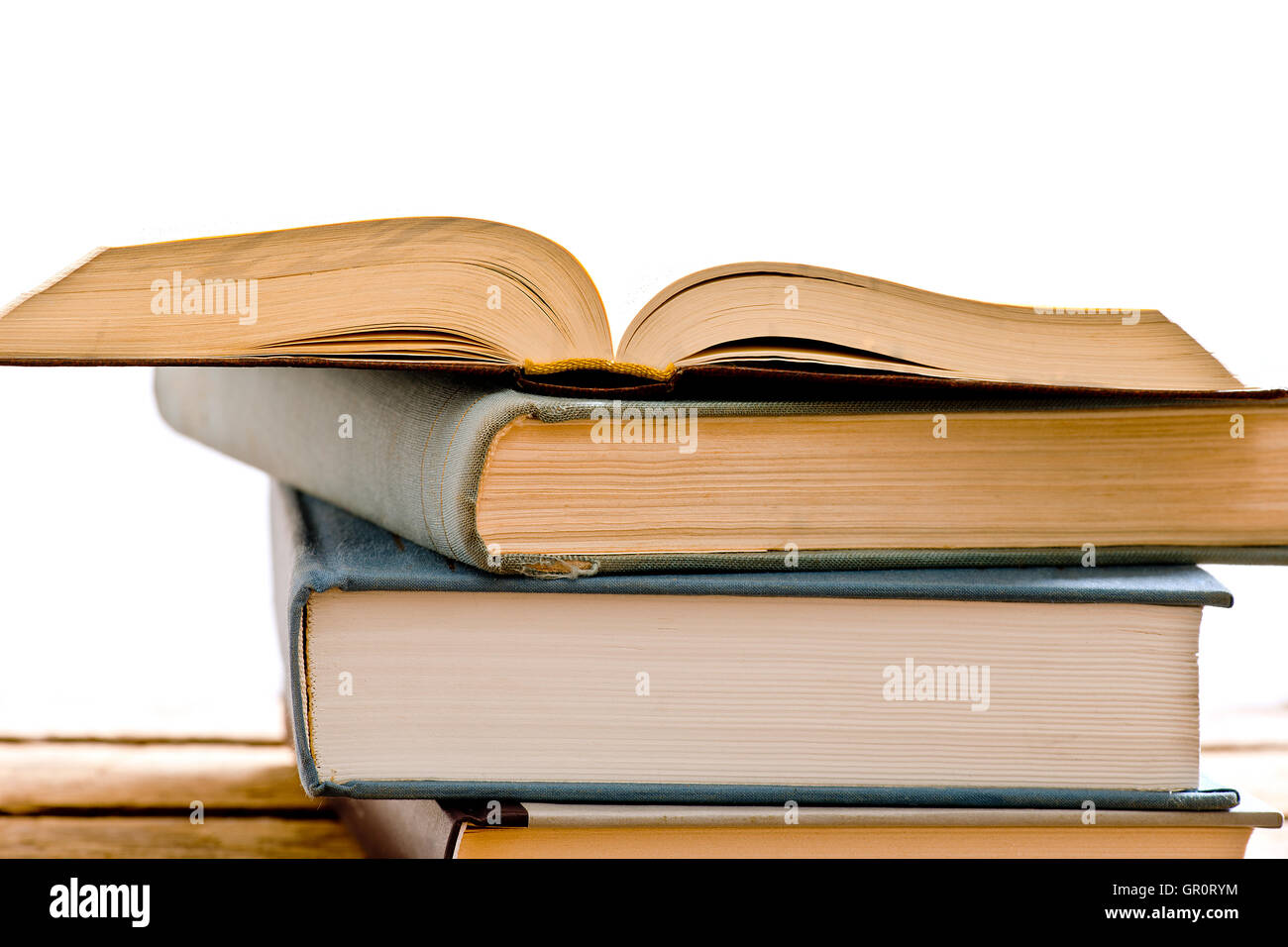 mound of open books on the white background Stock Photo - Alamy