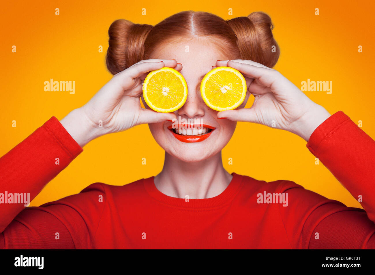 Young beautiful fashion model with Lemon. studio shot Stock Photo - Alamy