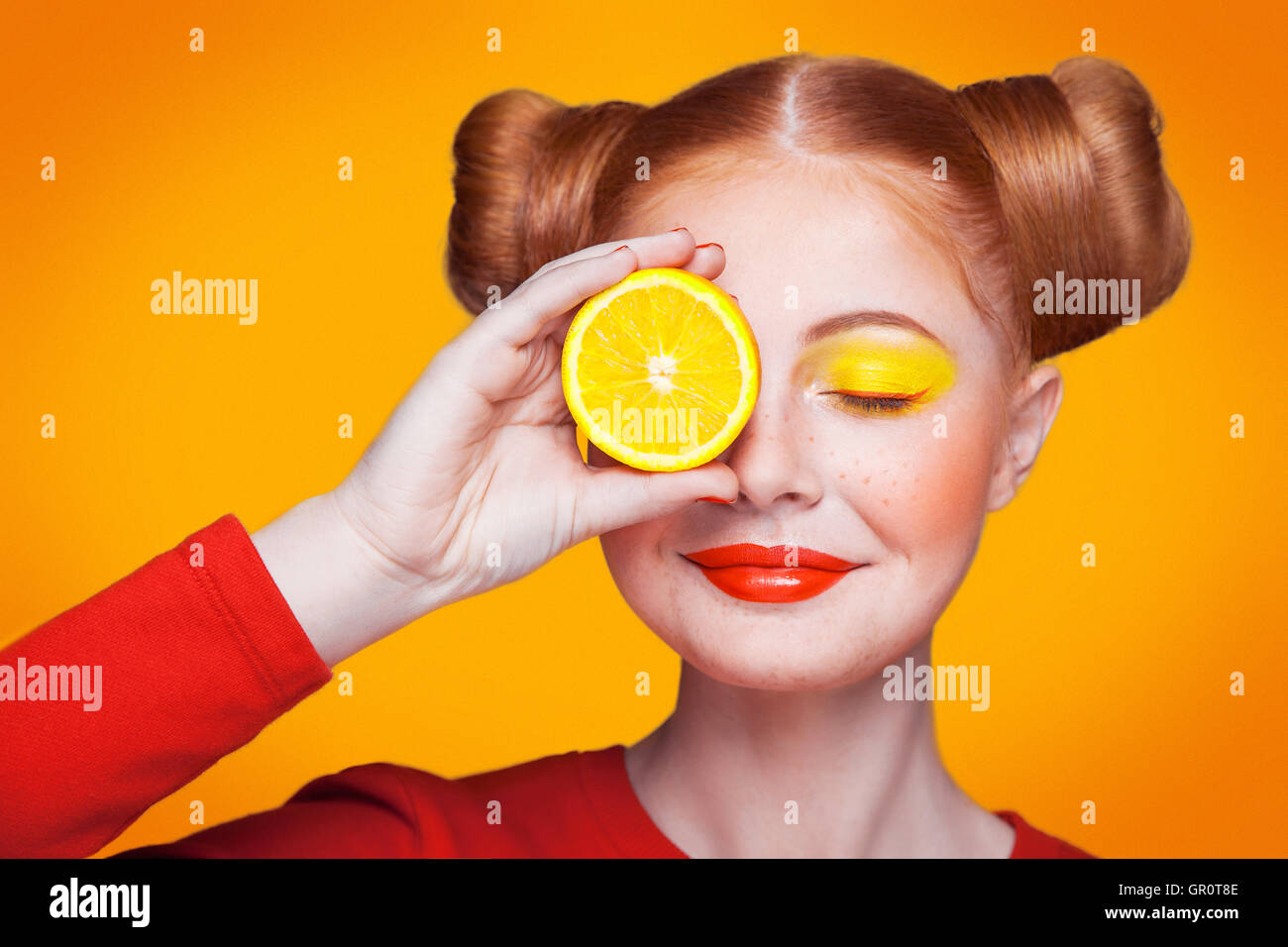 Young beautiful fashion model with Lemon. studio shot Stock Photo - Alamy