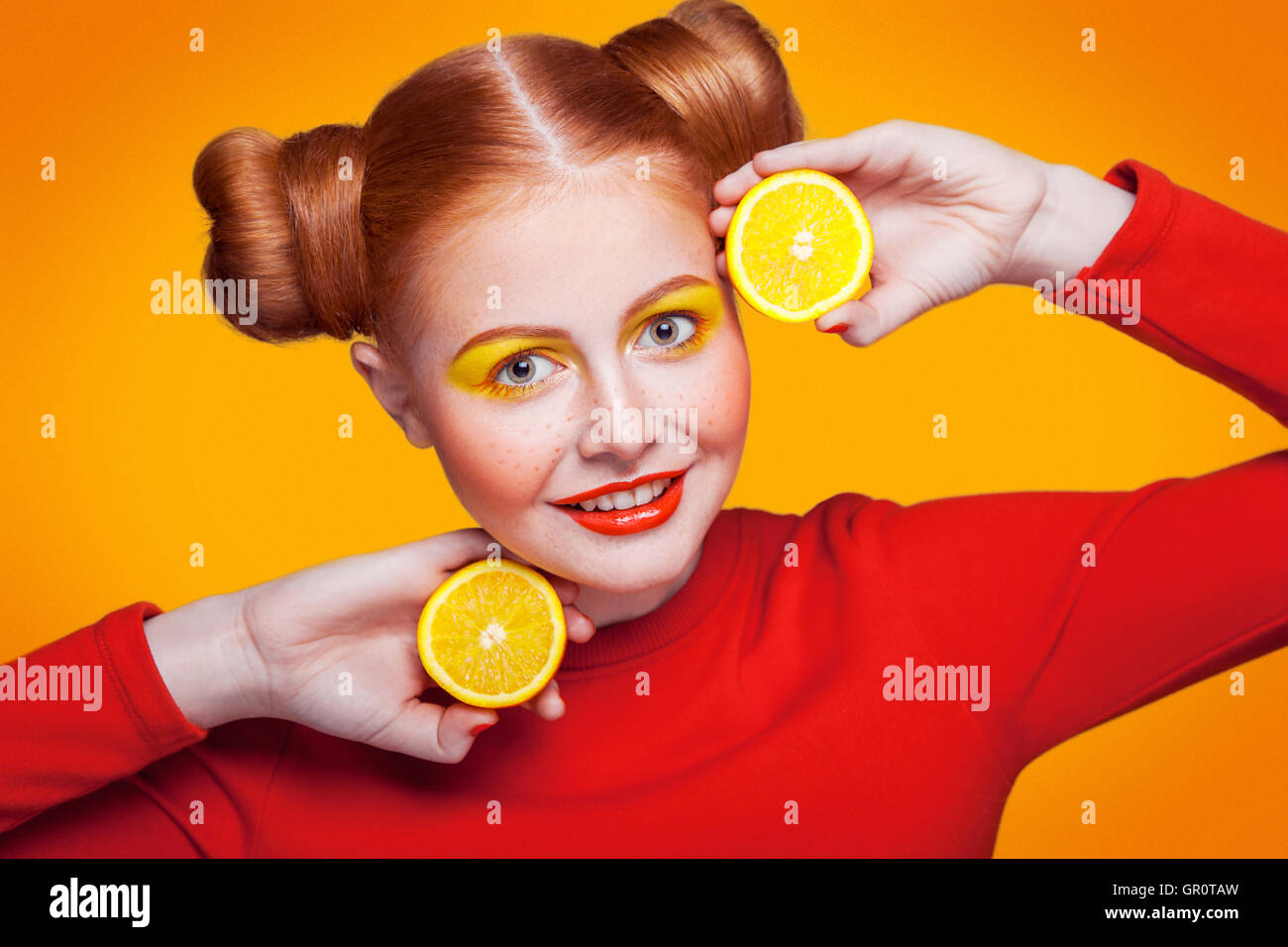 Young beautiful fashion model with Lemon. studio shot Stock Photo - Alamy