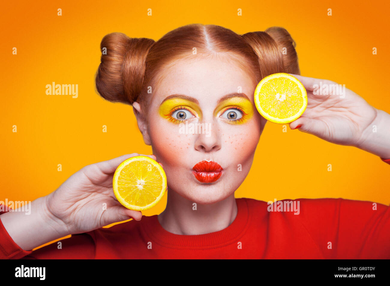 Young beautiful fashion model with Lemon. studio shot Stock Photo - Alamy