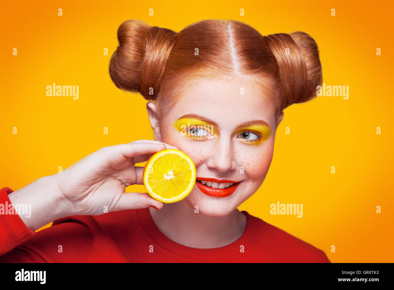 Young beautiful fashion model with Lemon. studio shot Stock Photo - Alamy