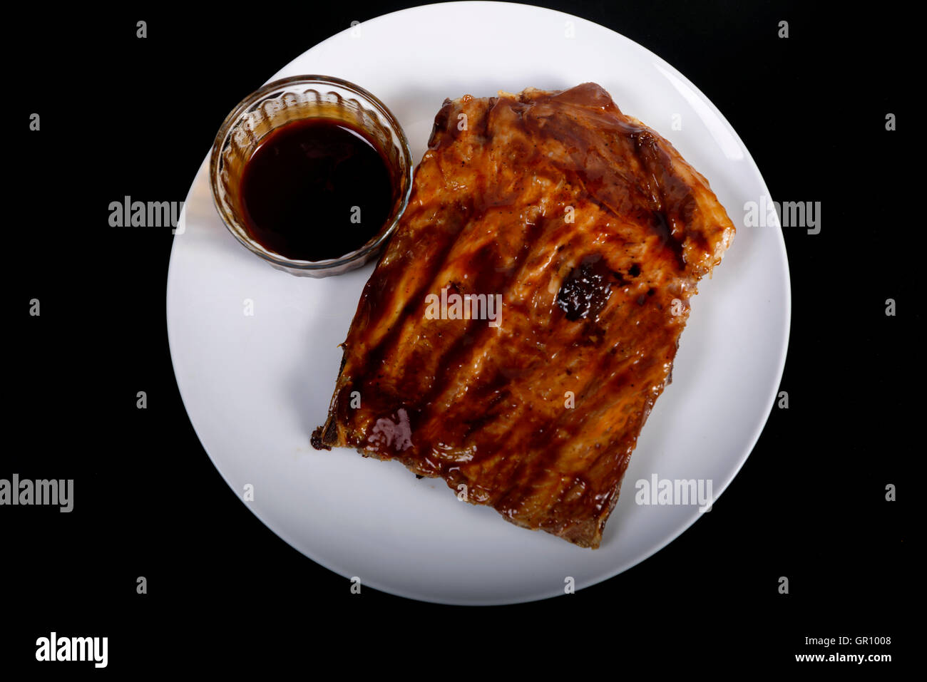 Rack of pork spare ribs and dipping sauce Stock Photo - Alamy