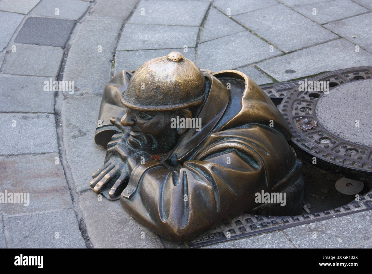 The watcher statue in Bratislava, Slovakia Stock Photo - Alamy